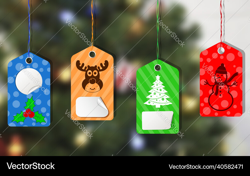 Christmas price tags hanging against blurred Vector Image