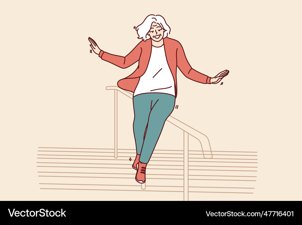 Elderly woman slides down stair railing having fun