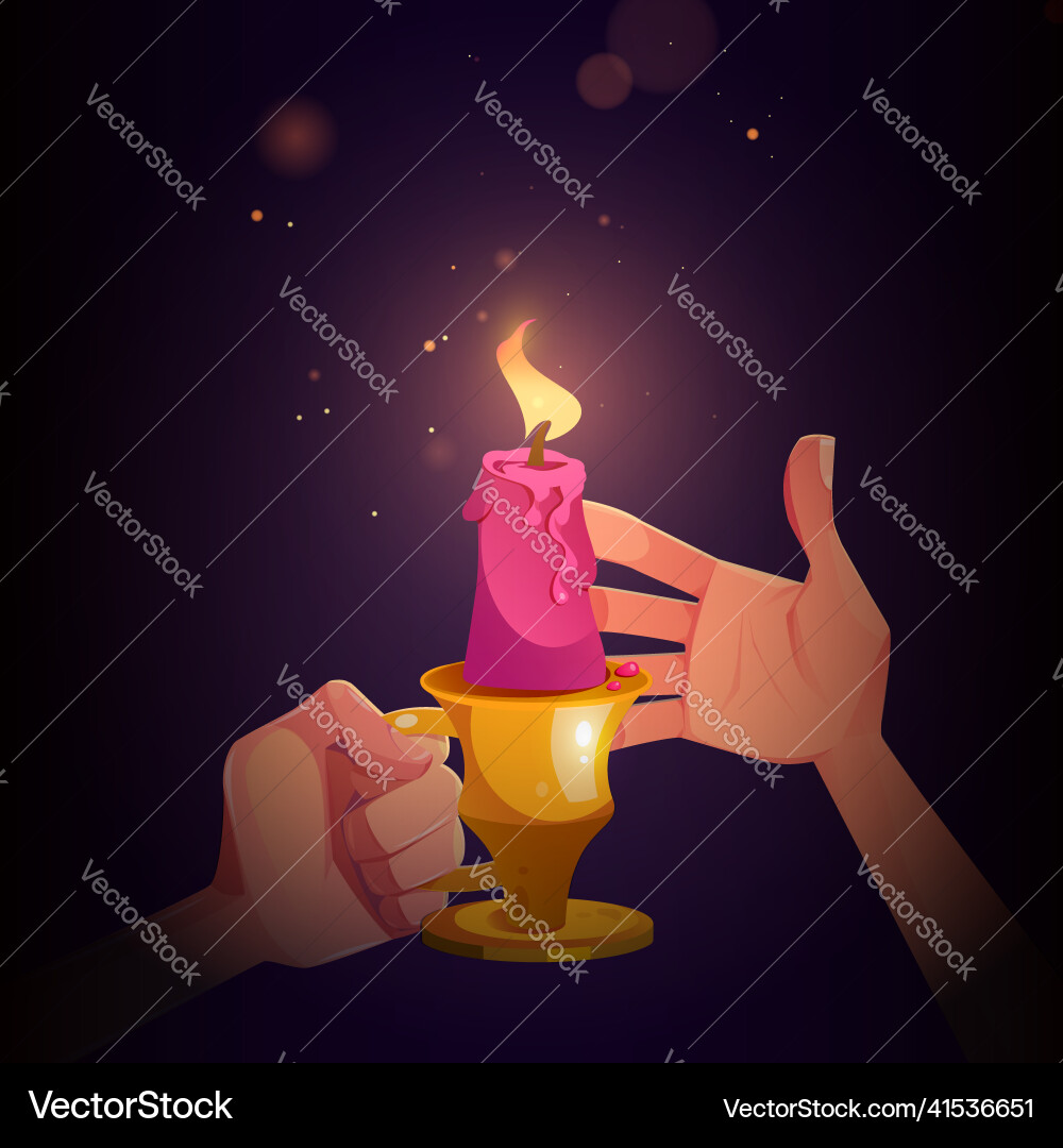 Hands with candle in metal candlestick with handle