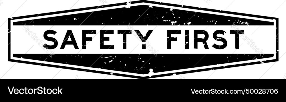 Grunge black safety first word hexagon rubber Vector Image