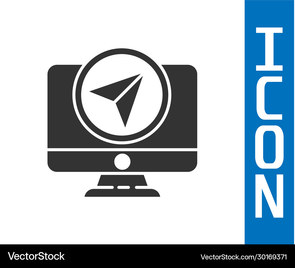 Grey computer monitor and folded map with location