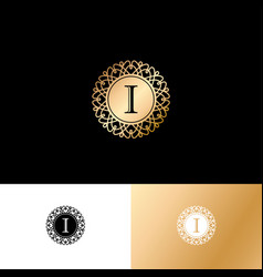 I gold letter with swirly ornaments Royalty Free Vector