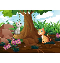 A cat under a tree Royalty Free Vector Image - VectorStock