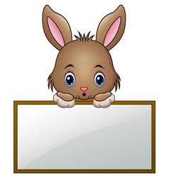 Cartoon little bunny holding an empty sign Vector Image